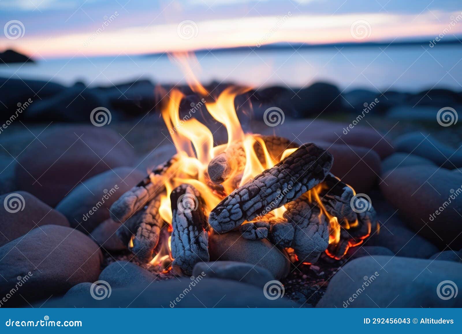 Close-up of a Glowing Campfire Surrounded by a Ring of Rocks at ...