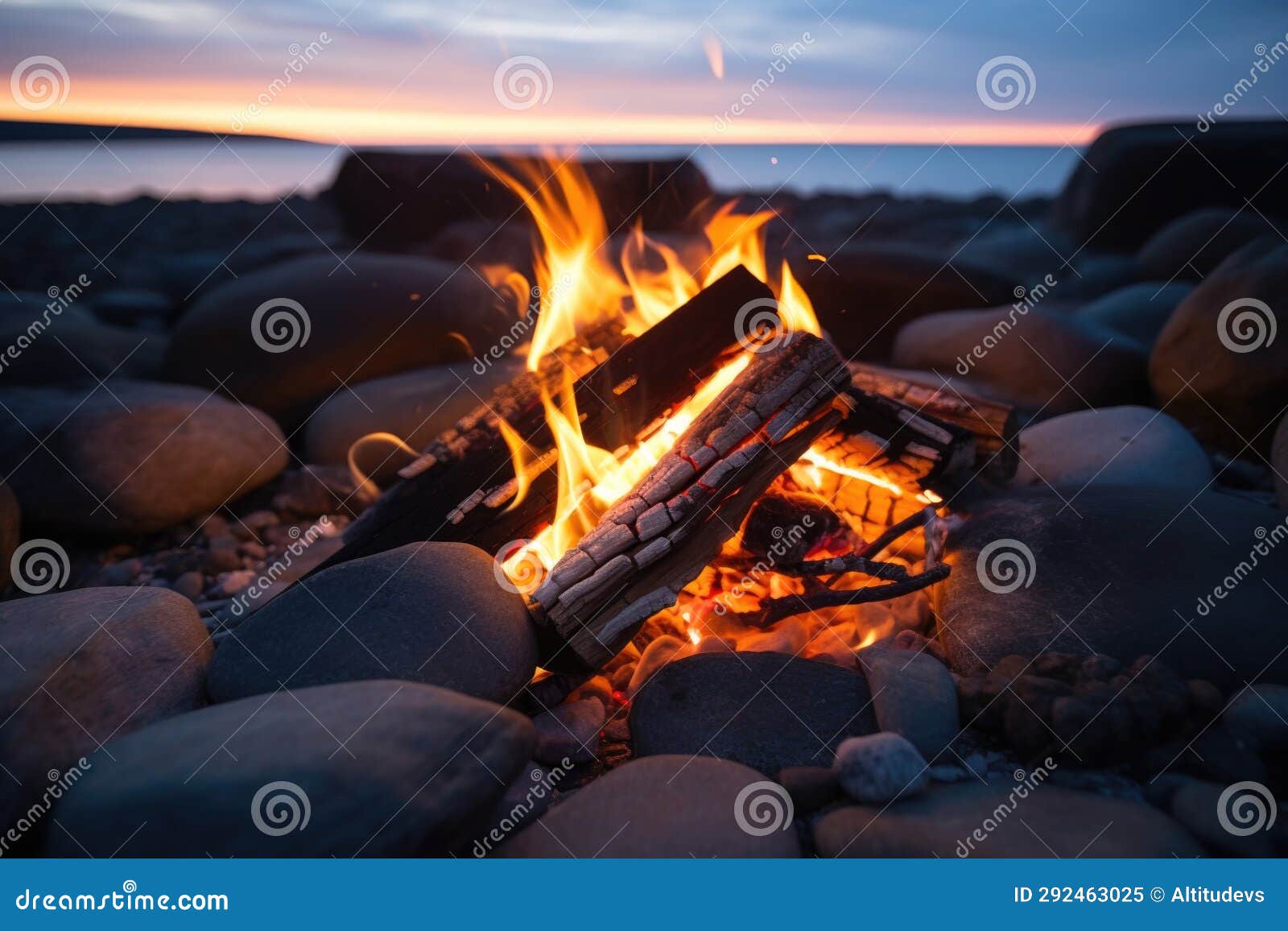 Close-up of a Glowing Campfire Surrounded by a Ring of Rocks at ...