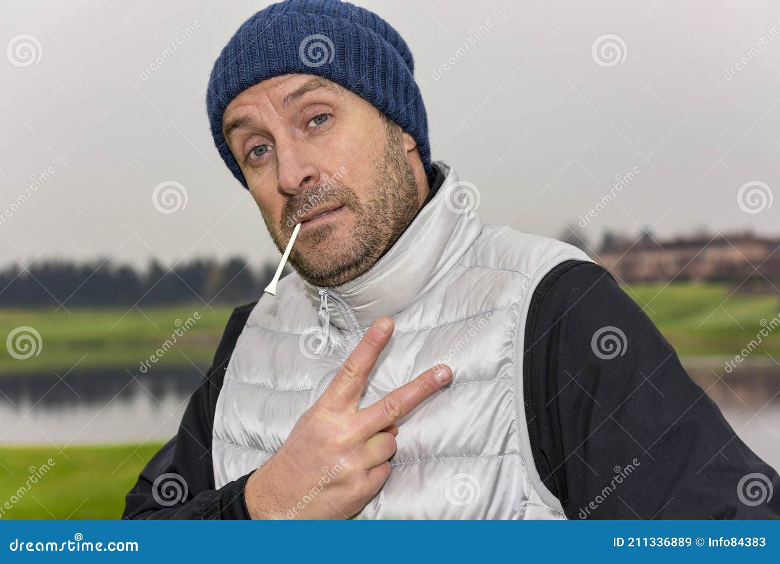 Close-up of a Chilled Golfer Approving of Playing in the Cold at a Golf ...