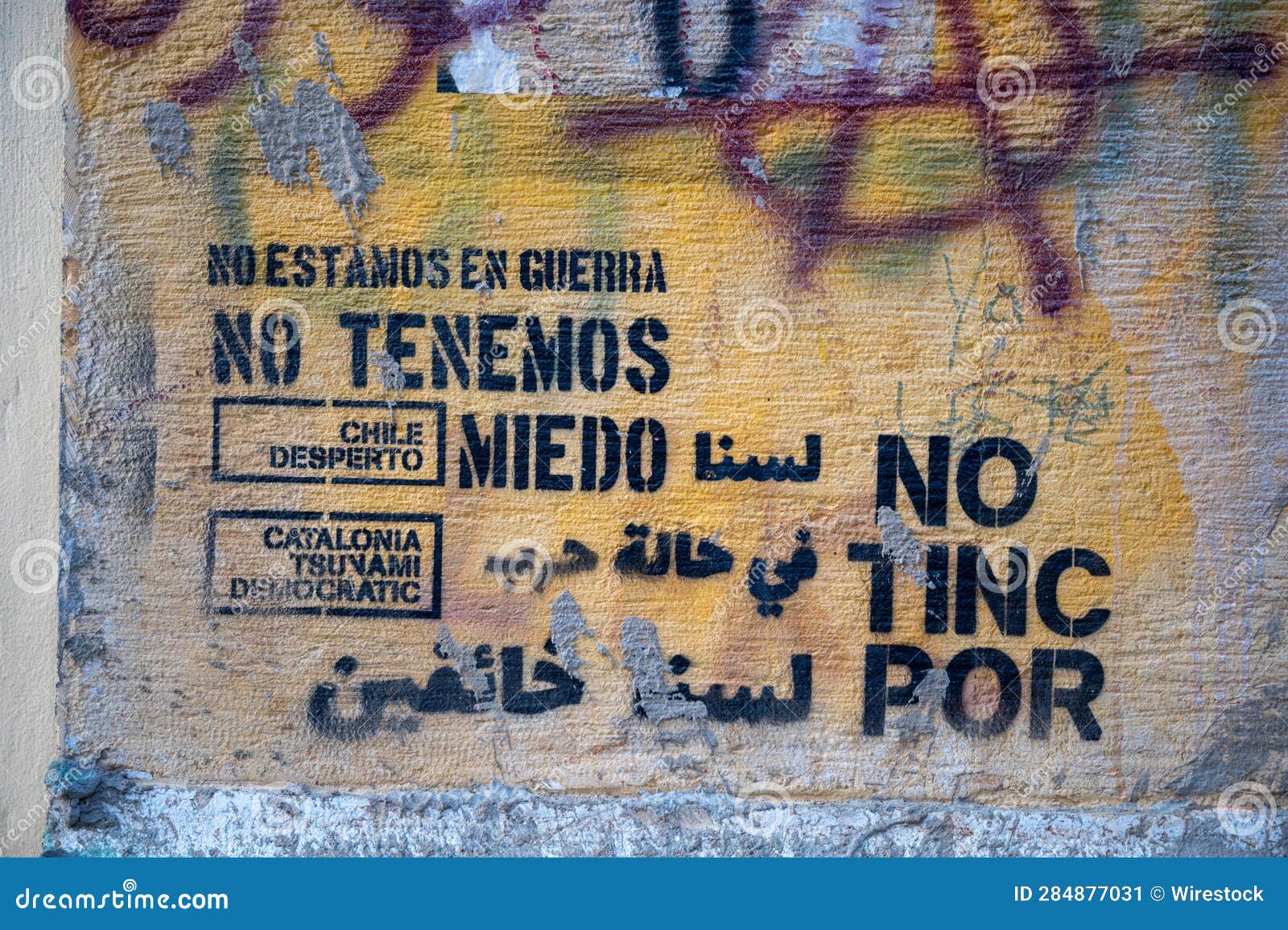 Close-up of a Graffiti Mural on a Wall, Featuring Different Phrases in ...