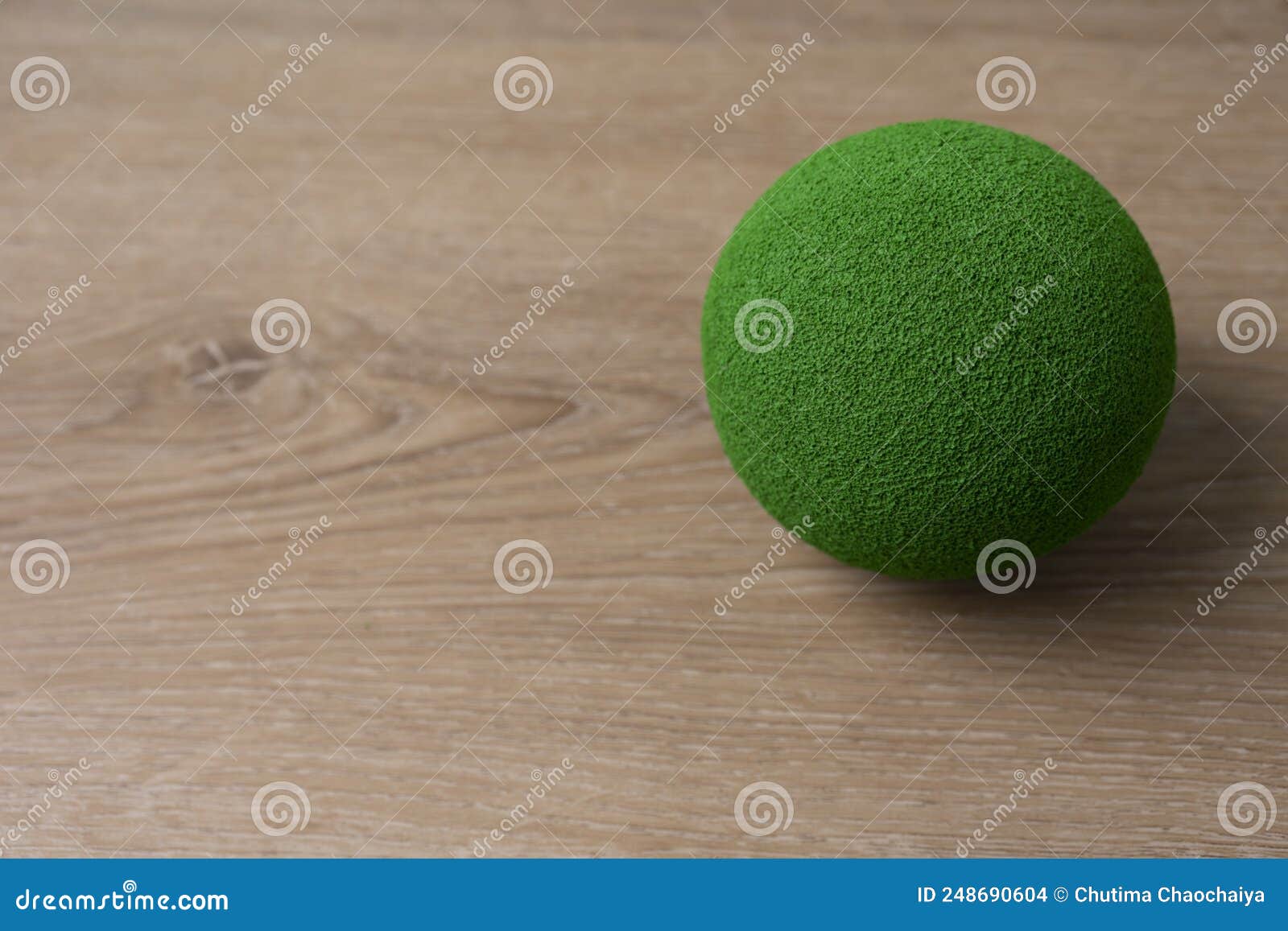Green Stress Ball on Wooden Table Background, Exercise or Stress Object ...