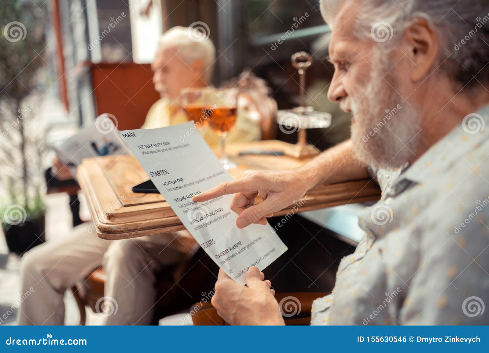 Close Up of Grey-haired Bearded Man Holding Menu and Choosing Dish ...