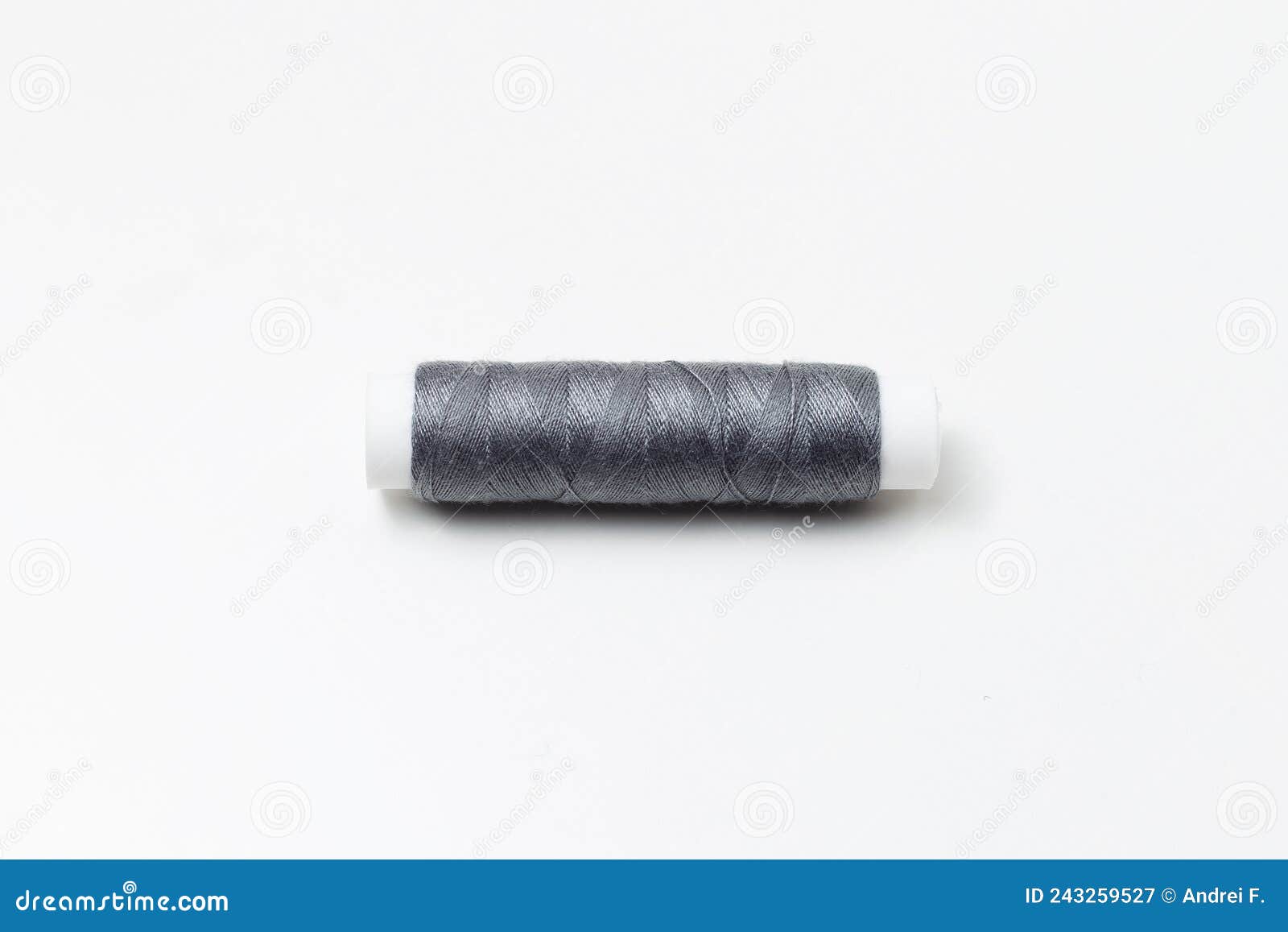 Close-up of Grey Thread Spool Isolated on White Background. Stock Image ...