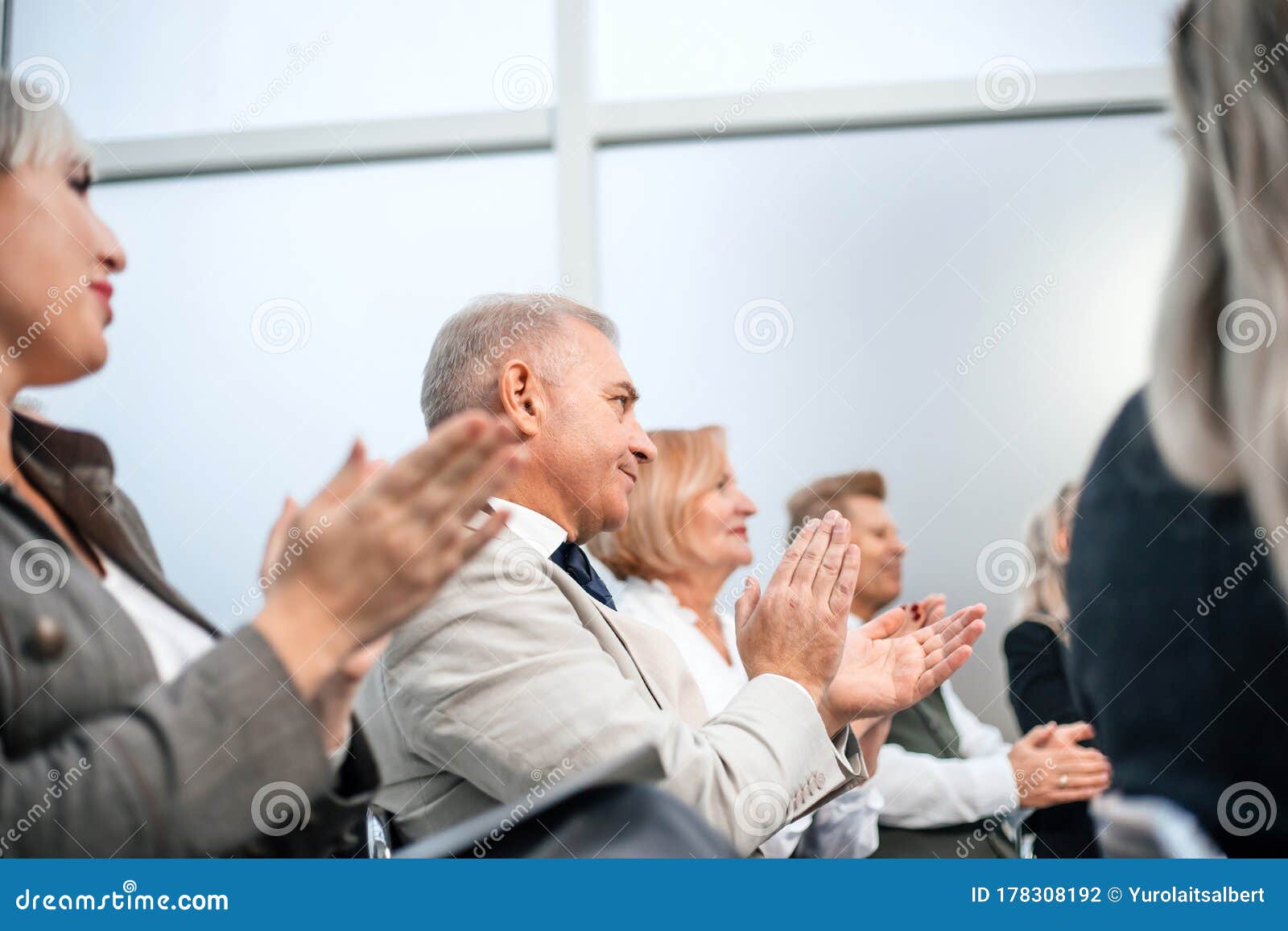 Close Up. a Group of Business People Applaud during a Business Seminar ... Close Up. a Group of Business People Applaud during a Business Seminar ...
