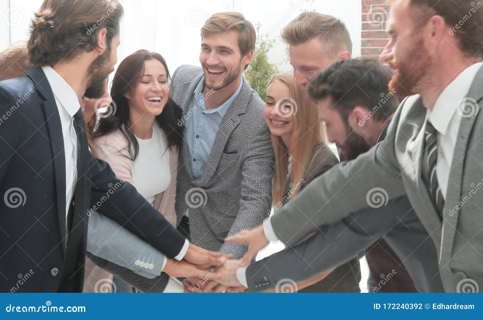 Close Up. a Group of Corporate Employees Showing Their Unity Stock ...