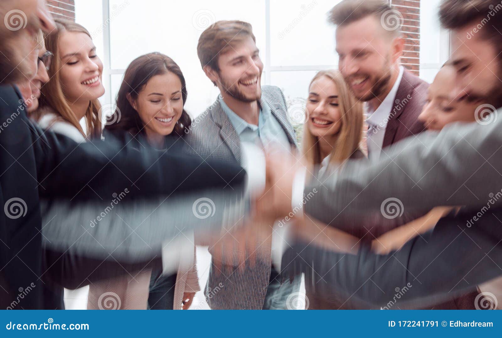 Close Up. a Group of Corporate Employees Showing Their Unity Stock ...