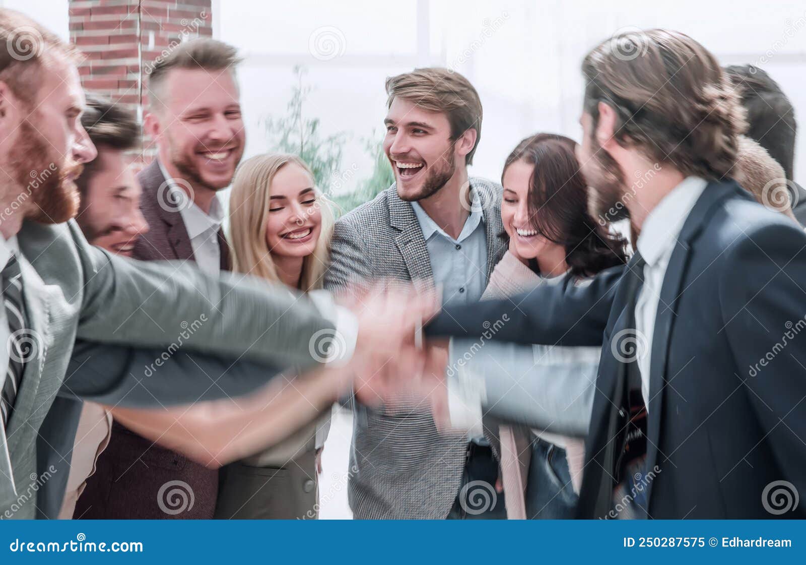 Close Up. a Group of Corporate Employees Showing Their Unity Stock ...