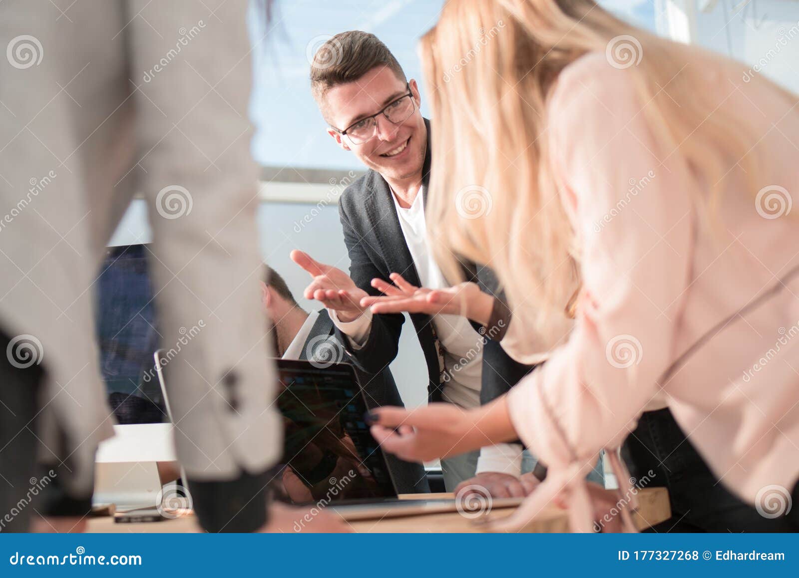 Close Up. Group of Office Employees Using a Laptop in the Office Stock ...