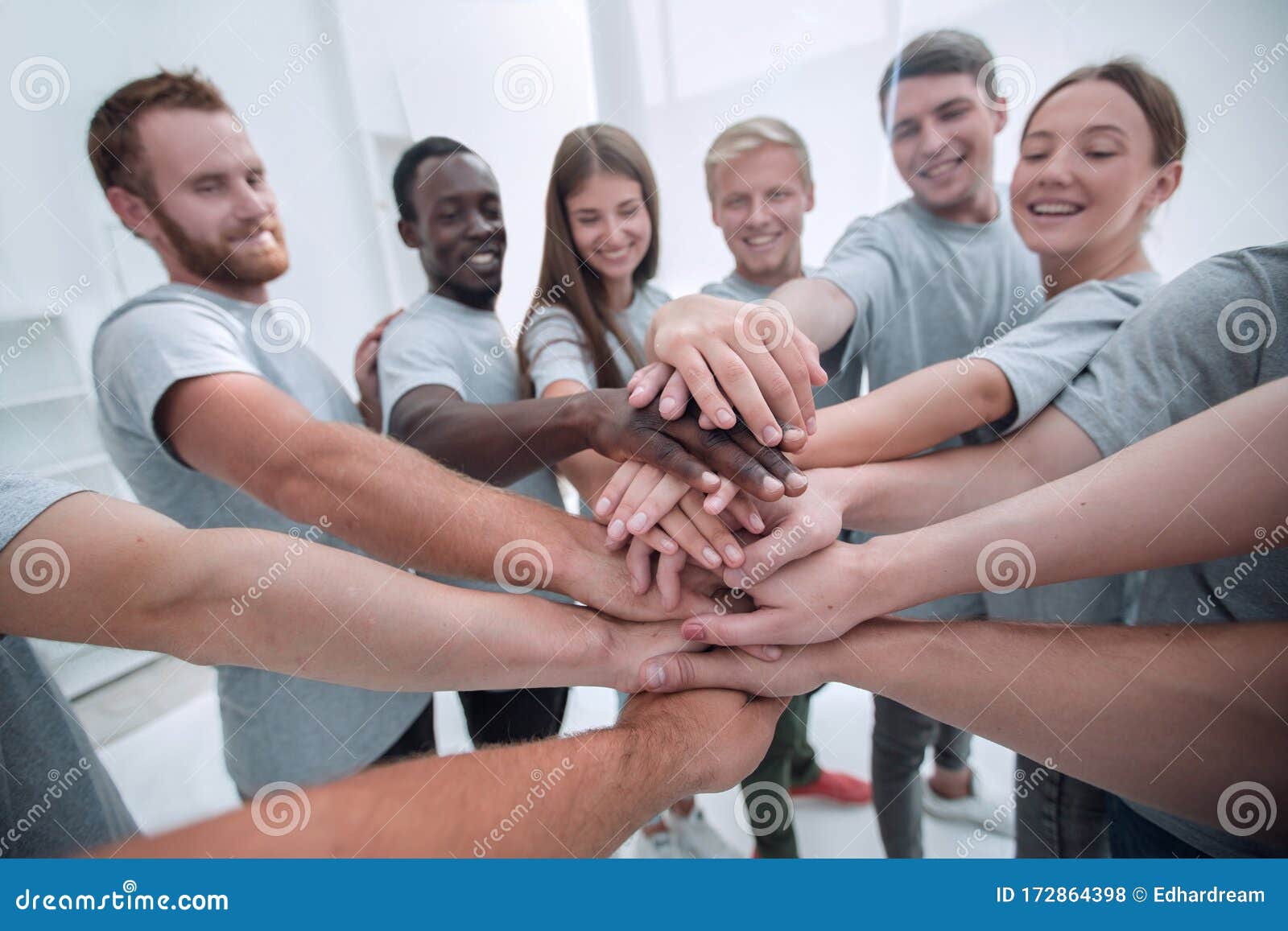 Close Up. a Group of Young People Showing Their Unity Stock Photo ...