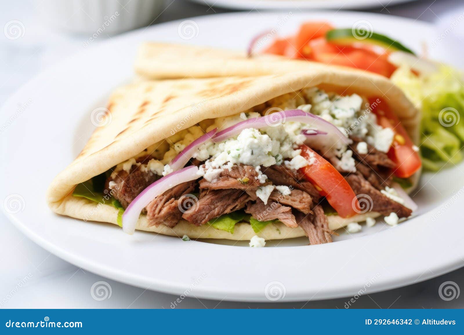 Close-up of a Gyro Sandwich on a White Plate Stock Photo - Image of ...
