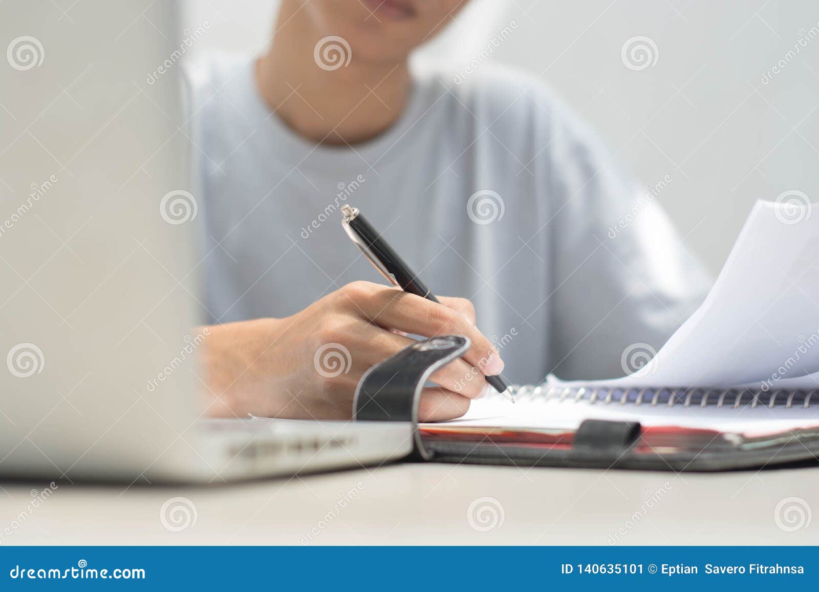 A Close Up with Hand Doing Home Work with Pen and Laptop Stock Image ...
