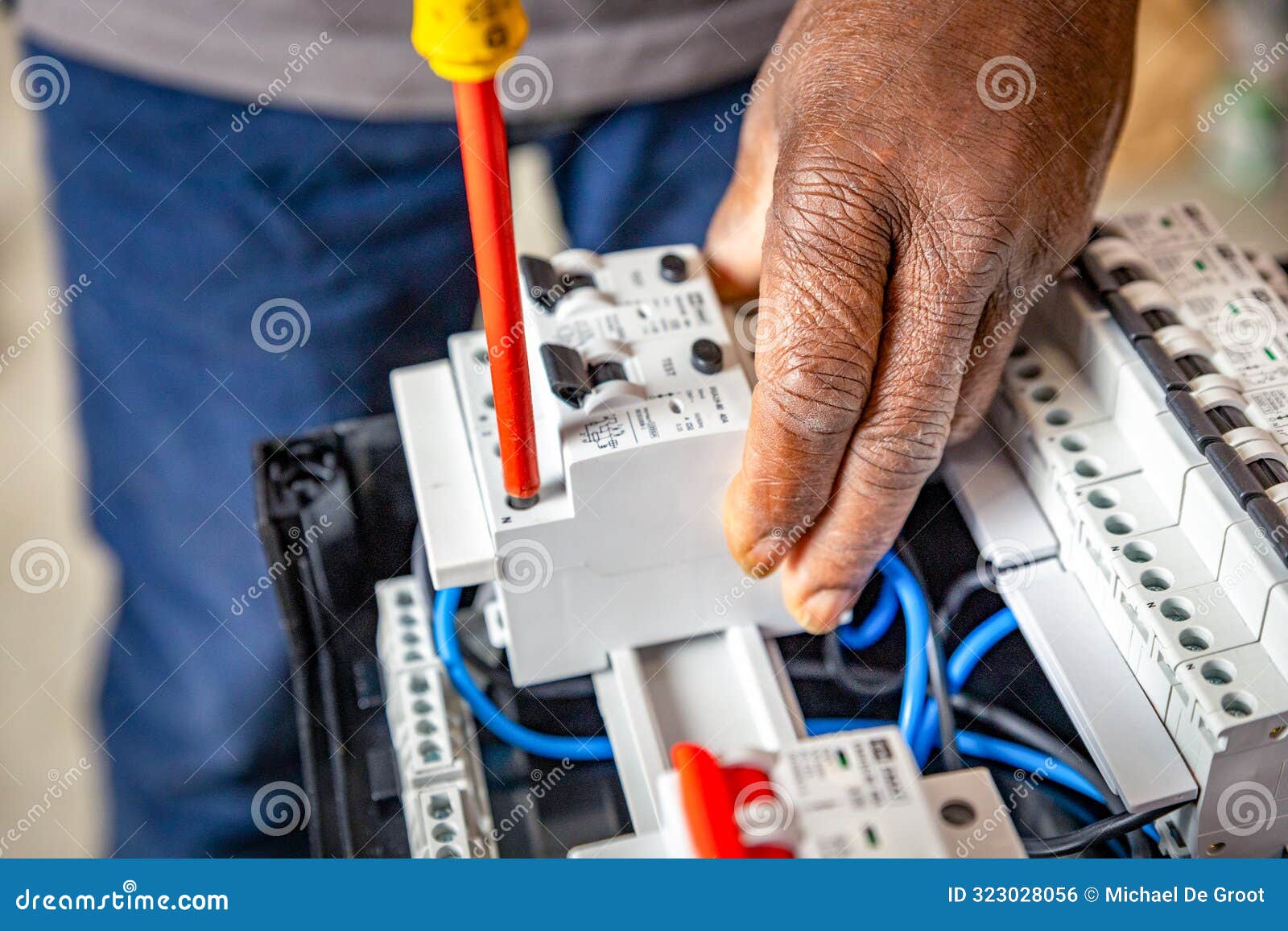 Close-up Hand of a Electrician Working on a Industrial Panel Mounting ...
