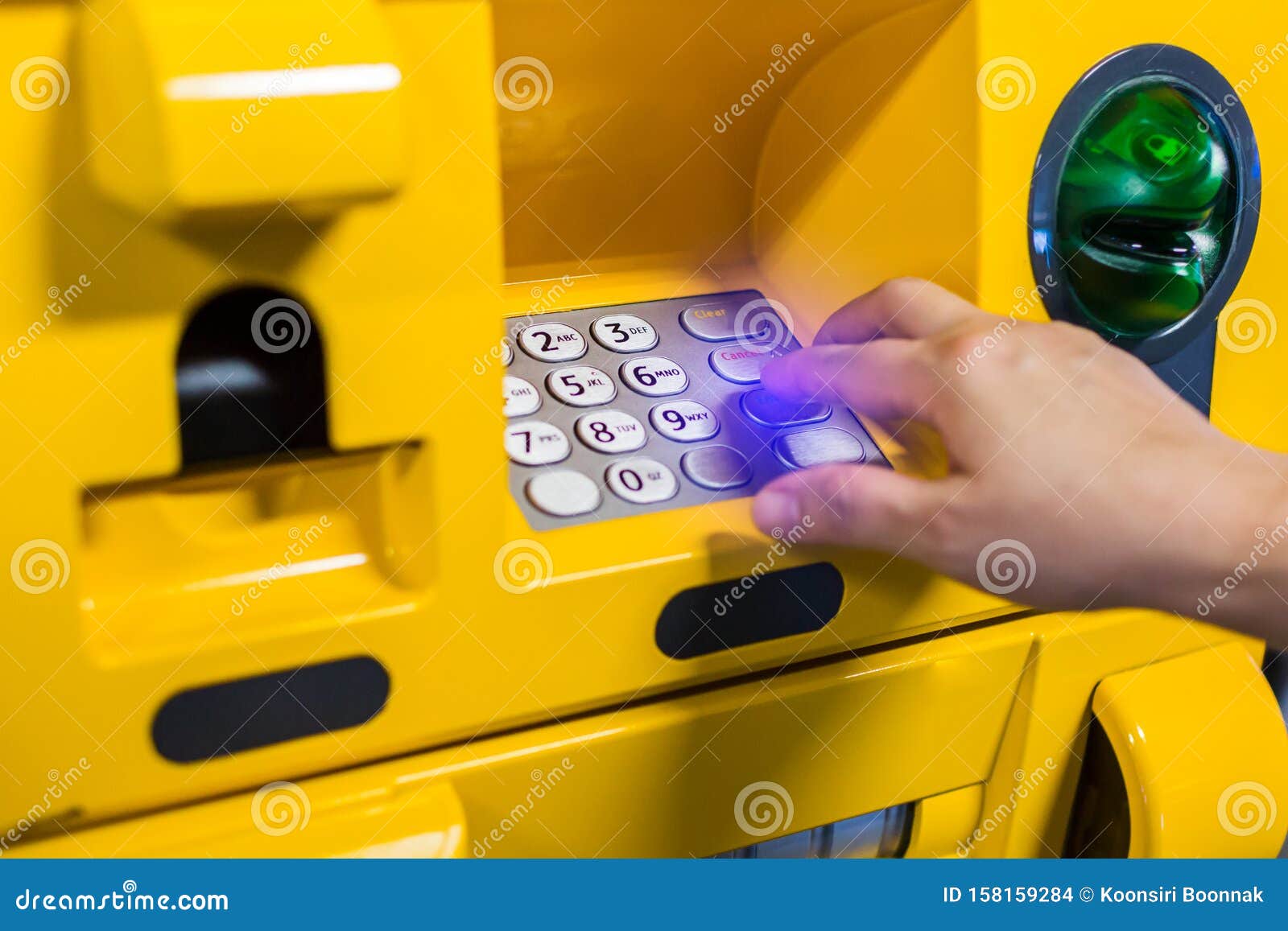 Finger about To Press a Pin Code on a Pad. Security Code on an Yellow ...
