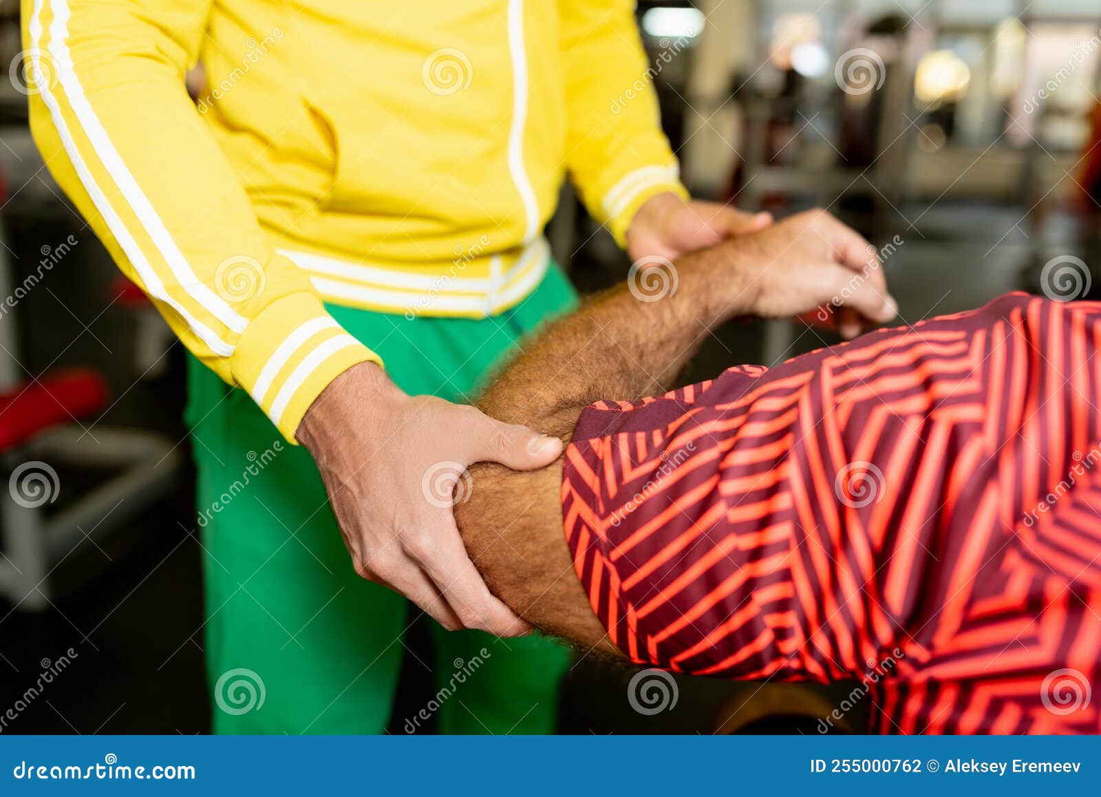 Close-up Hand of a Gym Trainer Helping an Athlete Stock Photo - Image ...