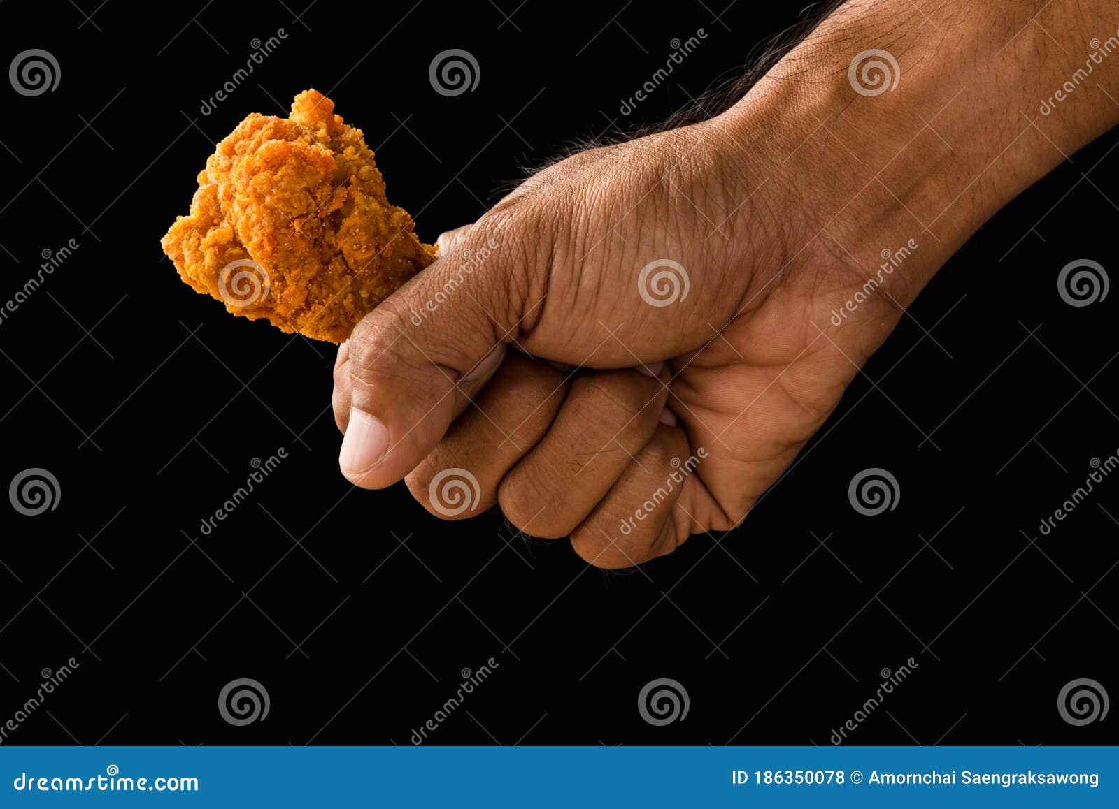 Close-up Hand Holding Fried Chicken on Black Background Stock Photo ...
