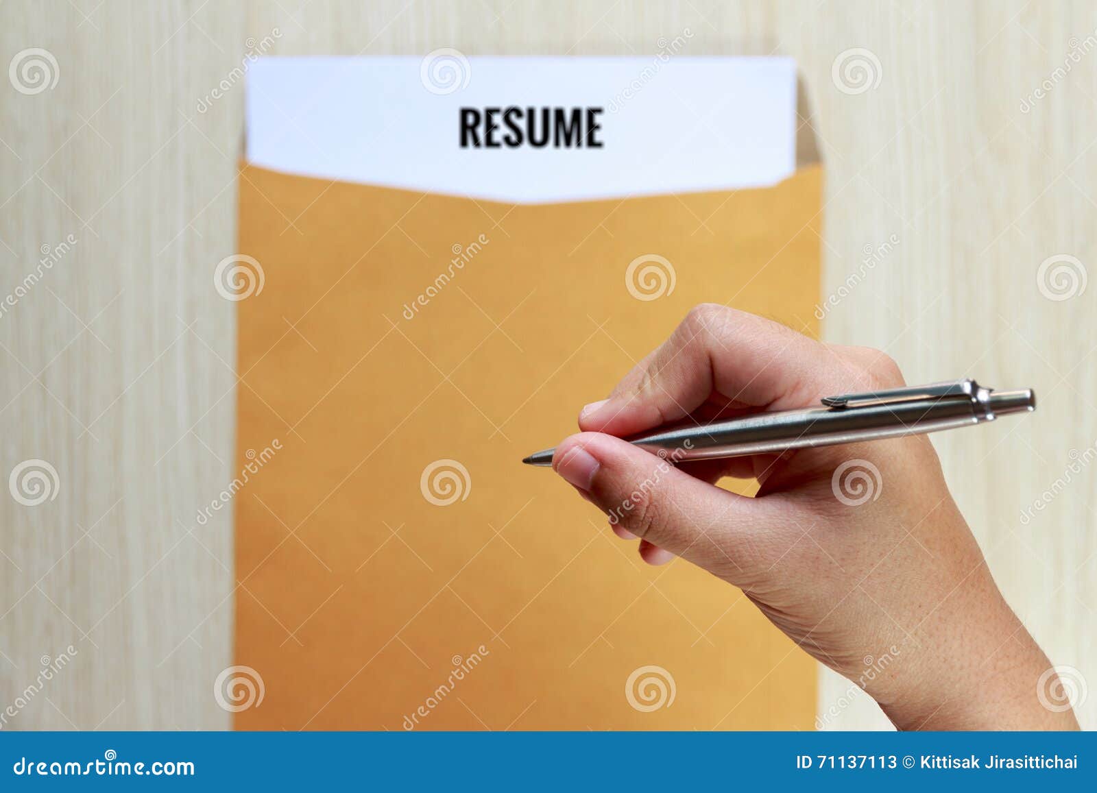 Close-up Hand Holding Pen Over the Resume in Envelope. Stock Image ...