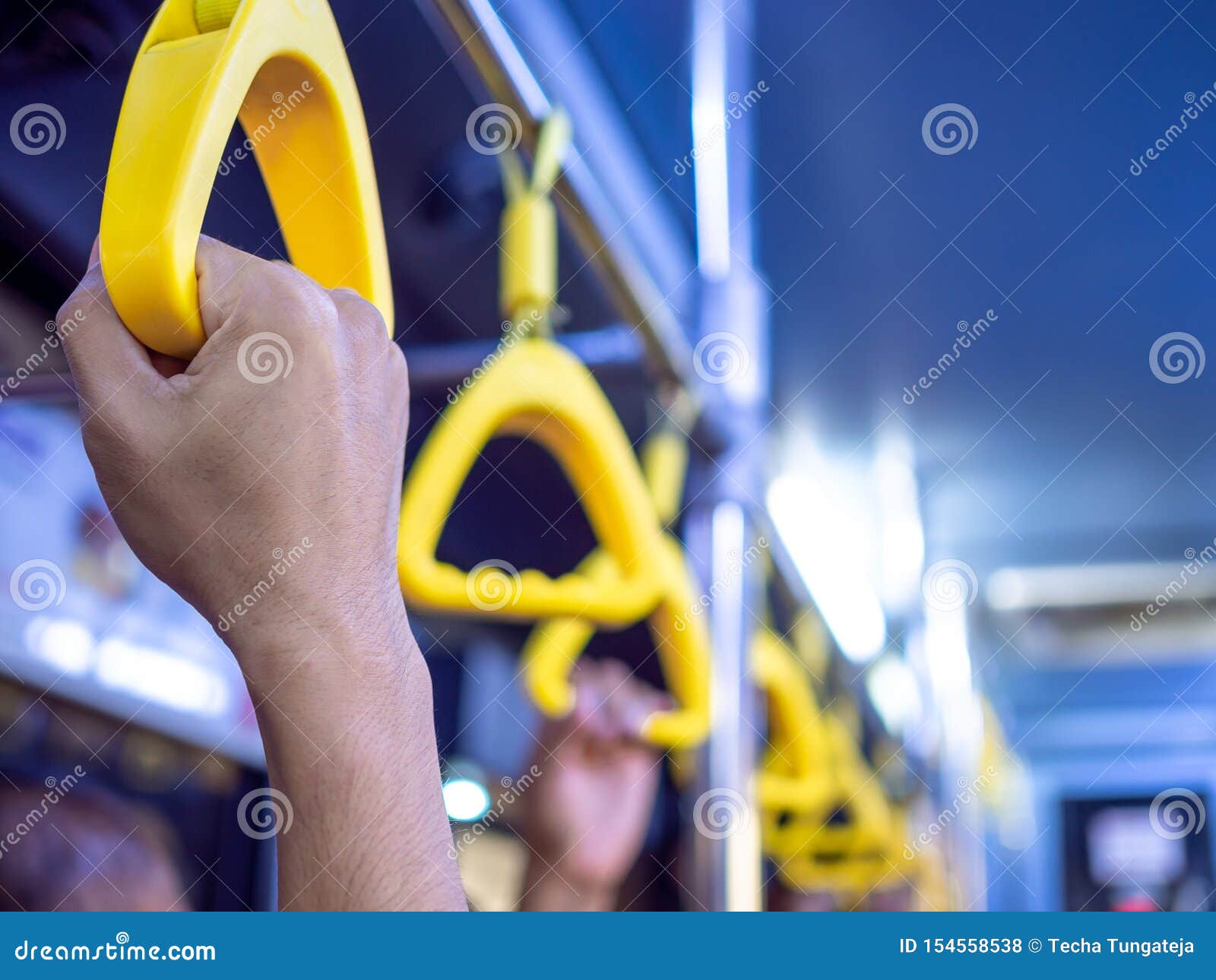 Close-up Hand Holding Yellow Handle in the Bus Stock Photo - Image of ...