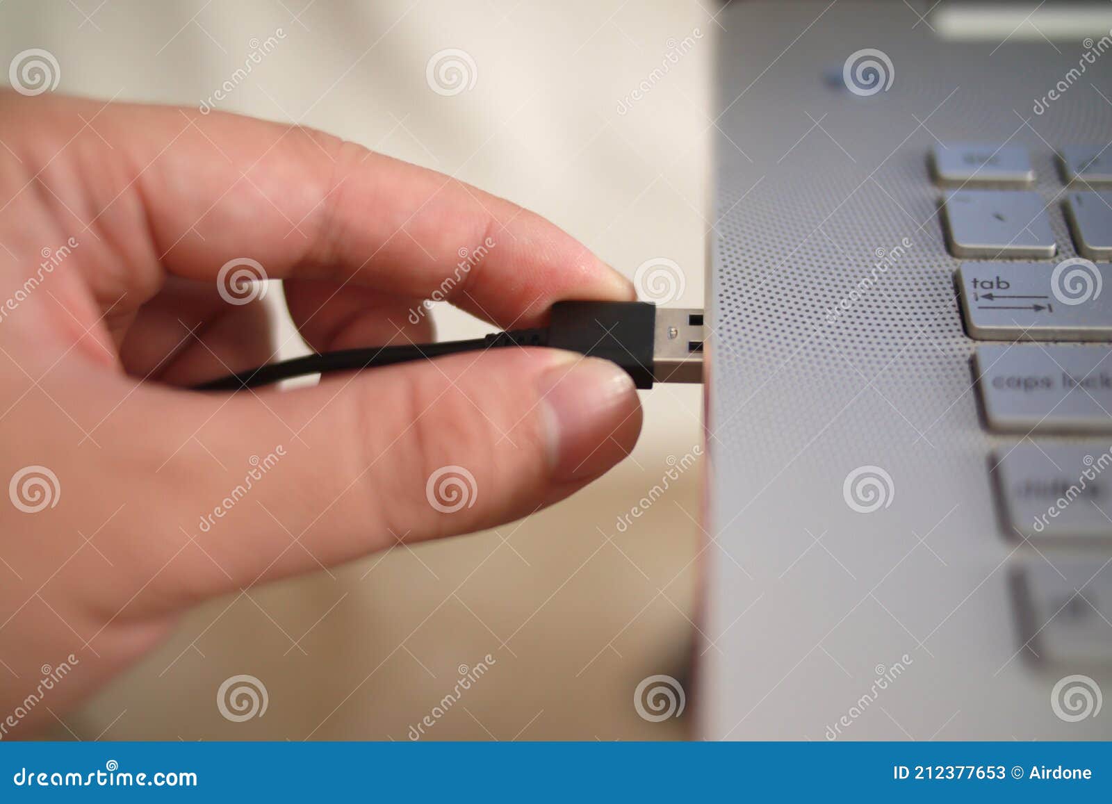 Close Up of Hand Inserting Plugging Data Cable into Usb Port in Laptop ...