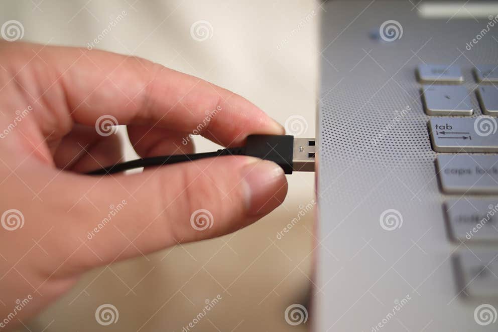 Close Up of Hand Inserting Plugging Data Cable into Usb Port in Laptop ...