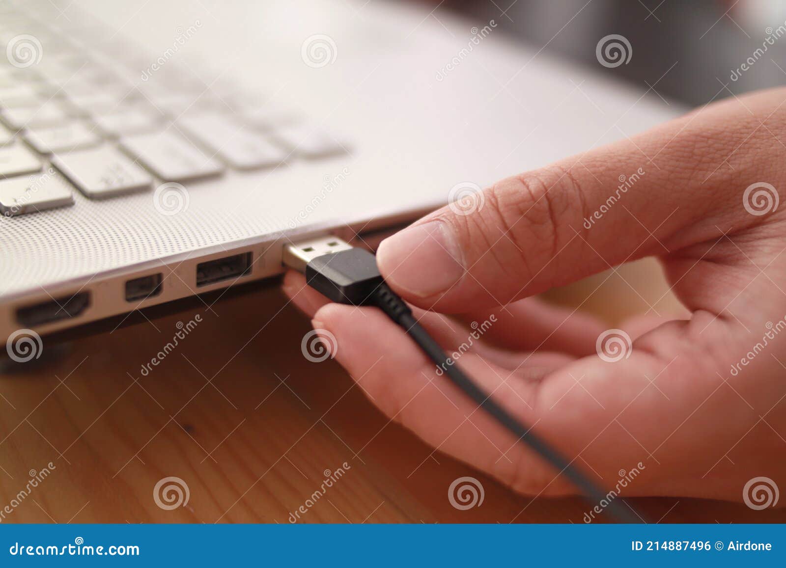 Close Up of Hand Inserting Plugging Data Cable into Usb Port in Laptop ...