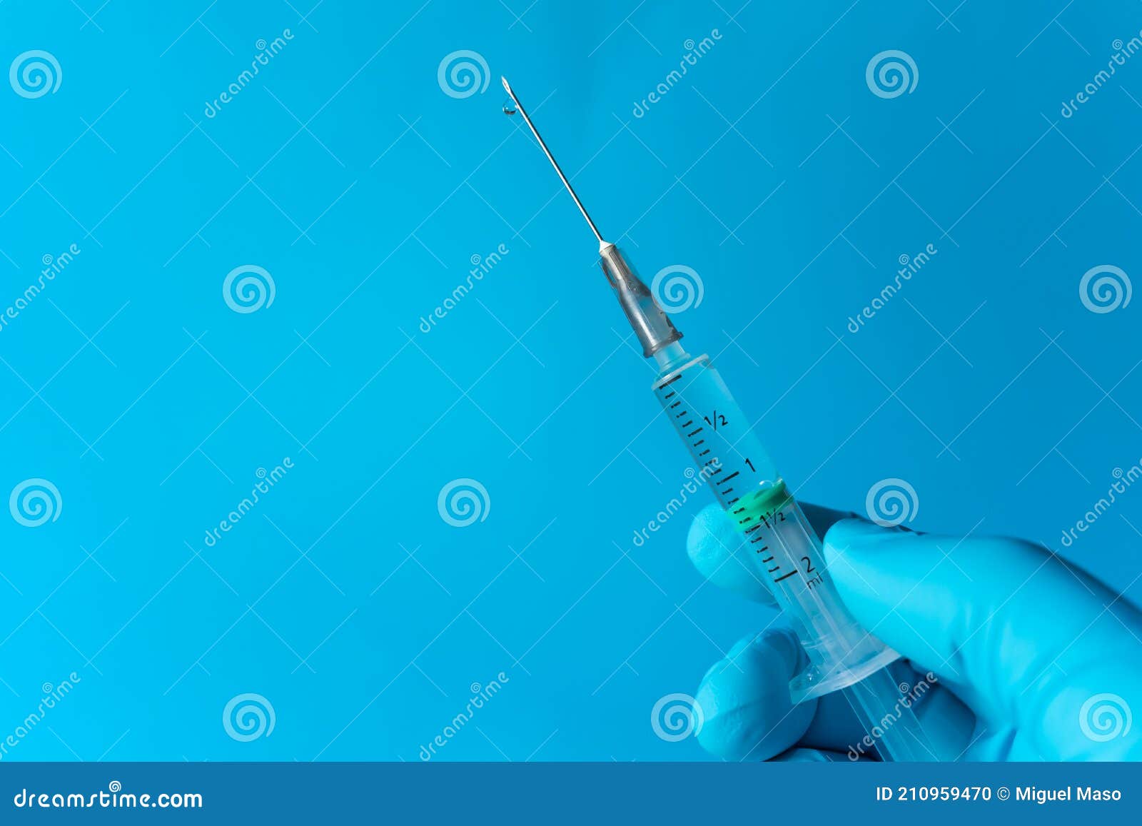 Close-up of a Hand in the Lower Right Corner of the Image Holding a ...