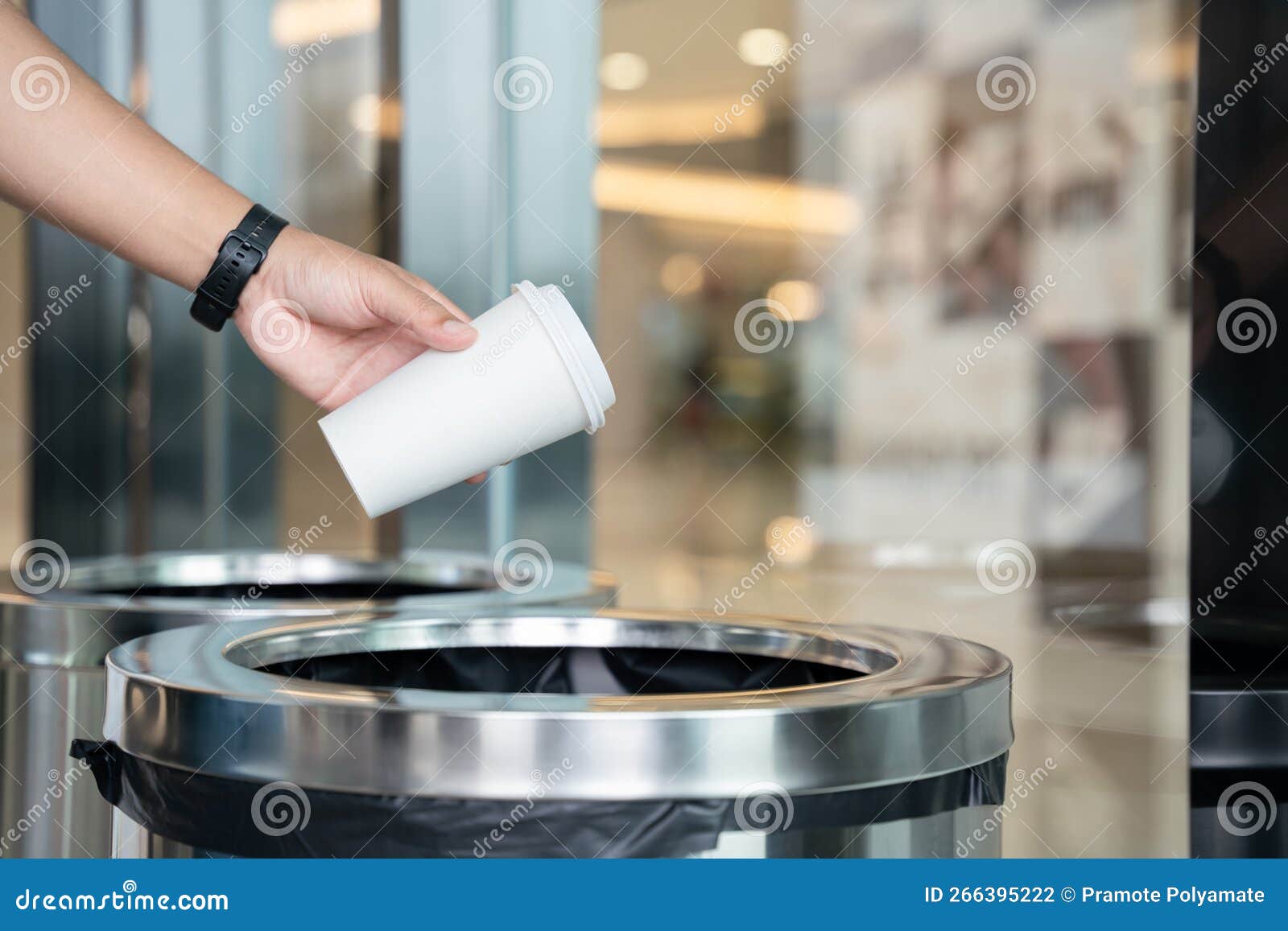 Close-up Hand of a Man Throwing Empty Paper Coffee Cup in Recycling Bin ...