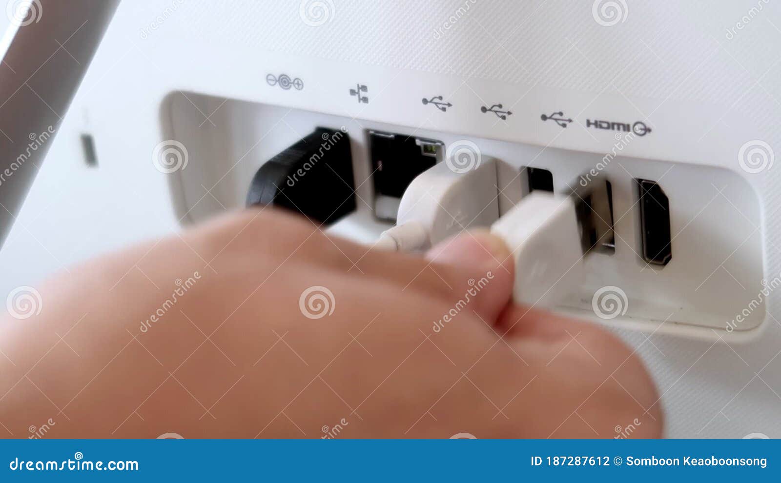 Close Up the Hand is Plugging the USB Port Behind the Computer Stock ...