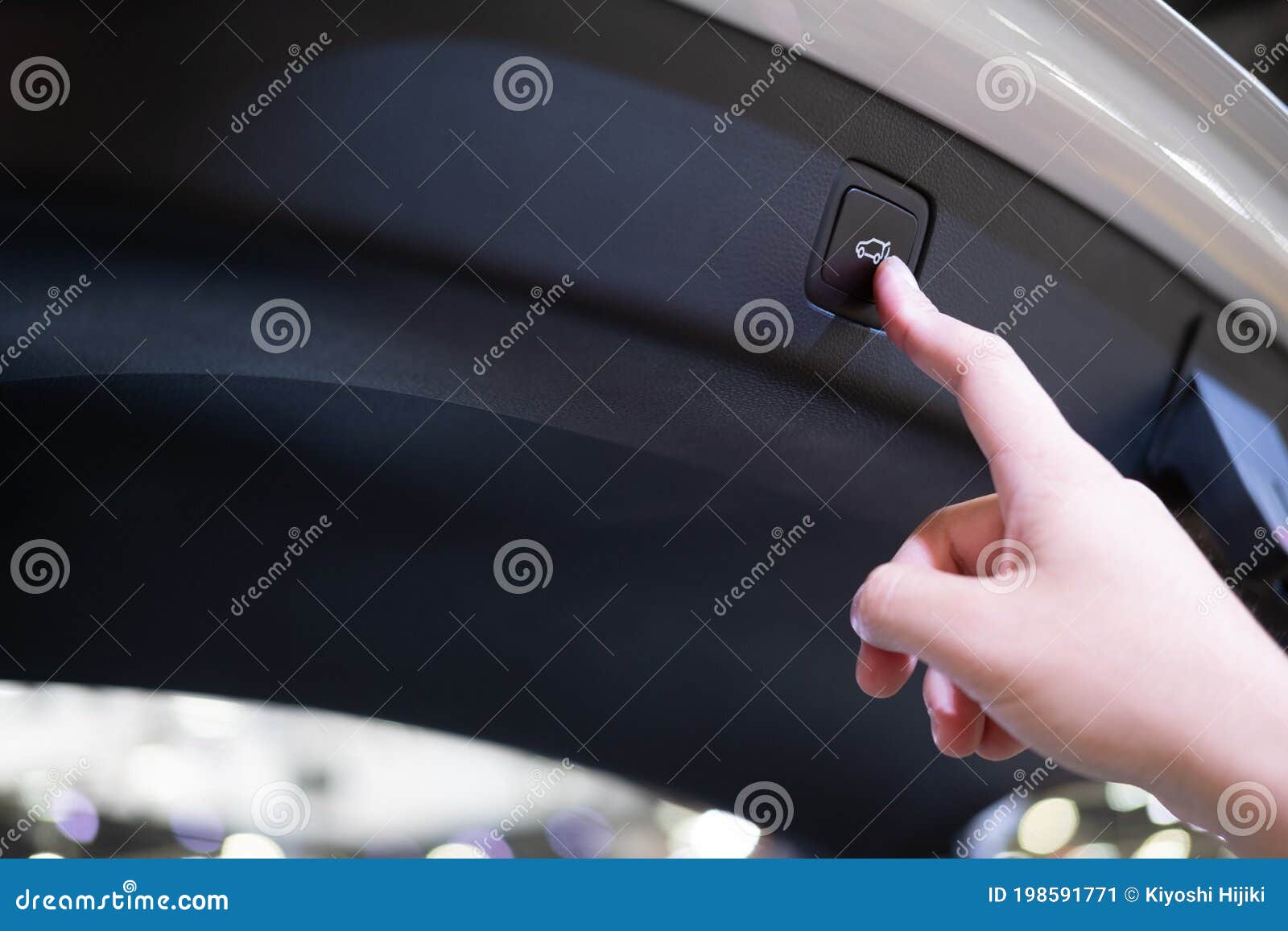 Close Up Hand Pushing Car Trunk To Unlock in Modern Hatchback Car Stock ...