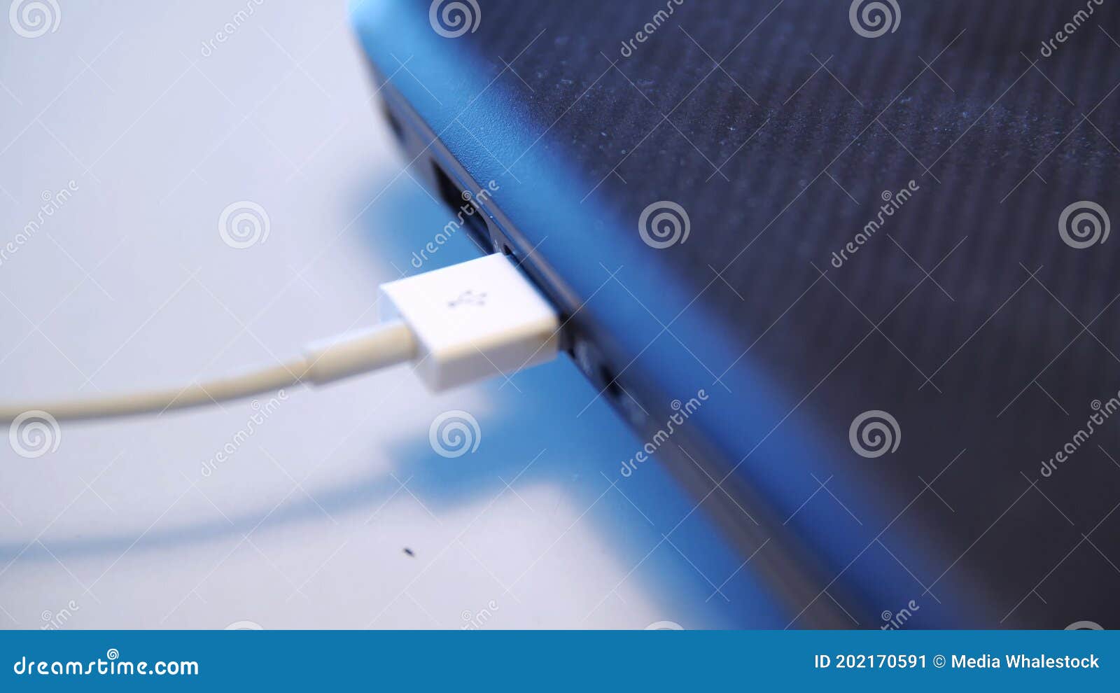 Close Up of Hand Putting USB Cable into External Hard Disk Isolated on ...