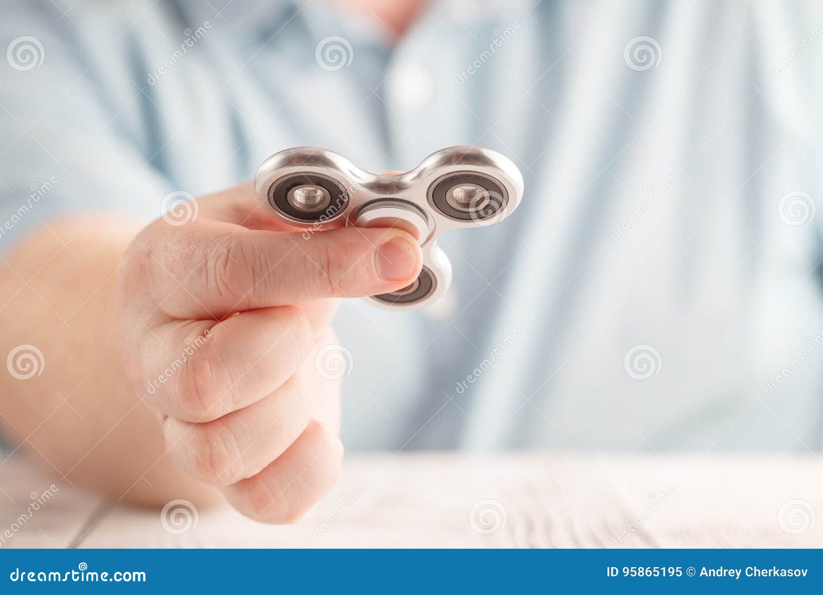 Close-up of a Hand S Man Holding a Fidget Spinner Stock Image - Image ...