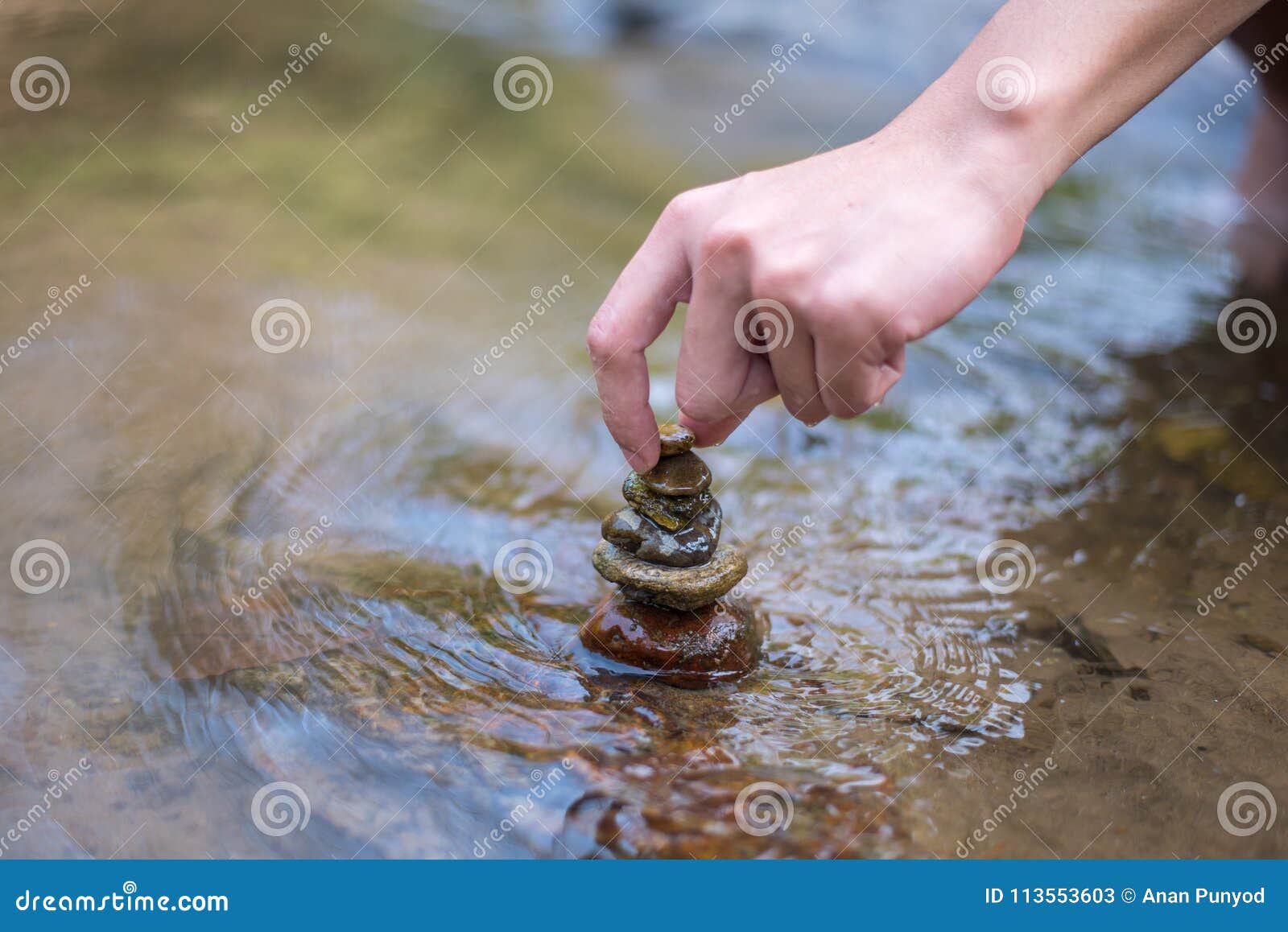 Close Up Hand To Doing Stone Stacked in Water River Stock Image - Image ...