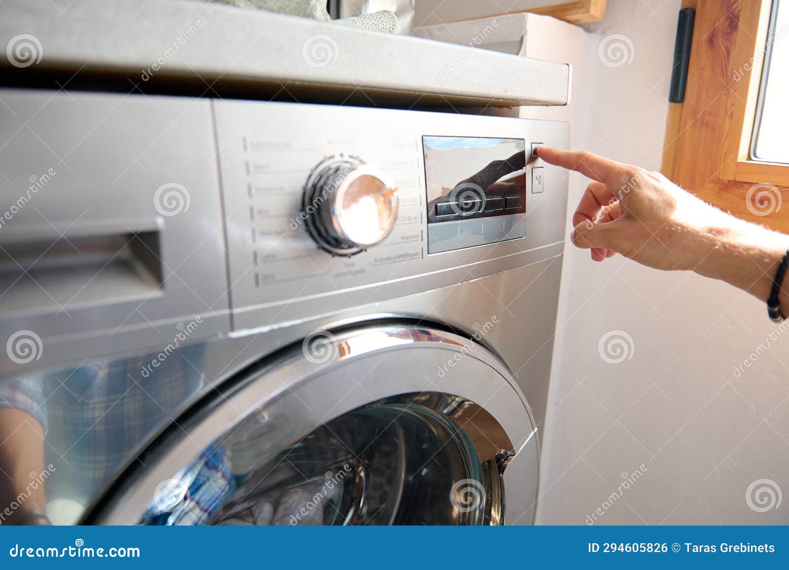 Close-up Hand Turning on Automatic Washing Machine or Select Program ...