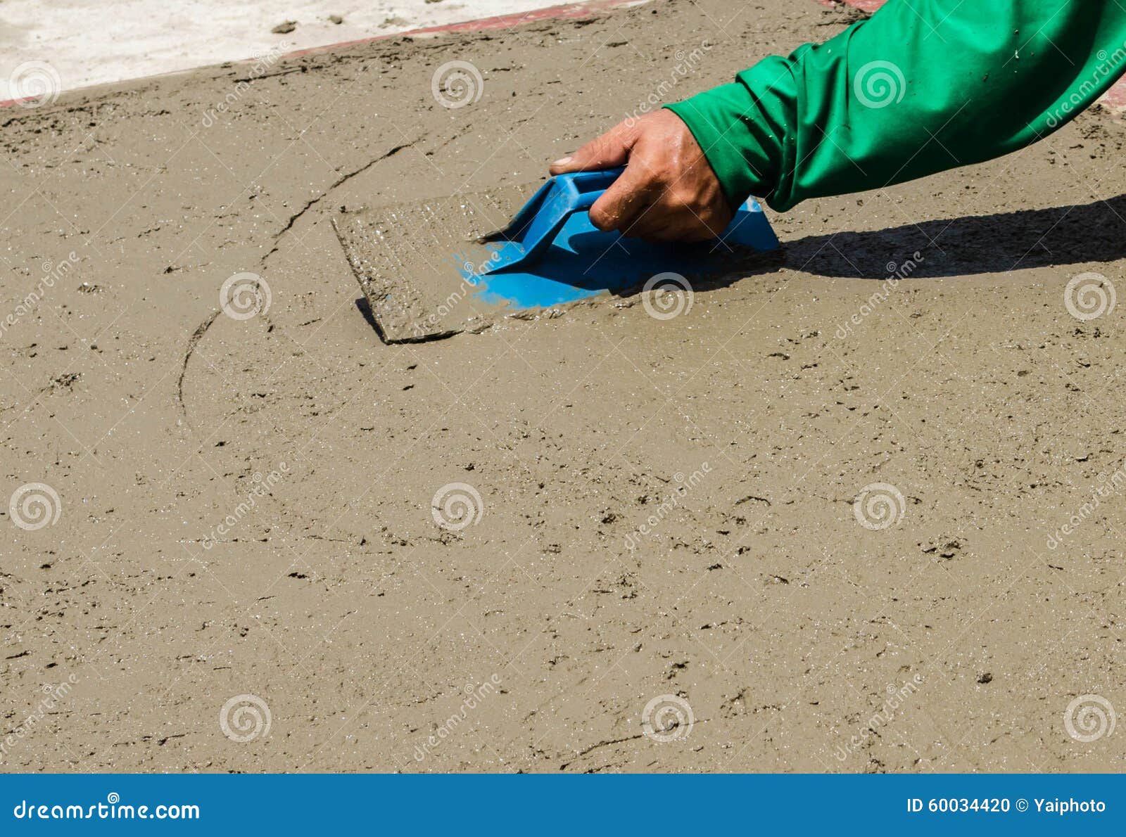 Close-up of Hand Using Trowel To Finish Wet Concrete Floor Stock Photo ...