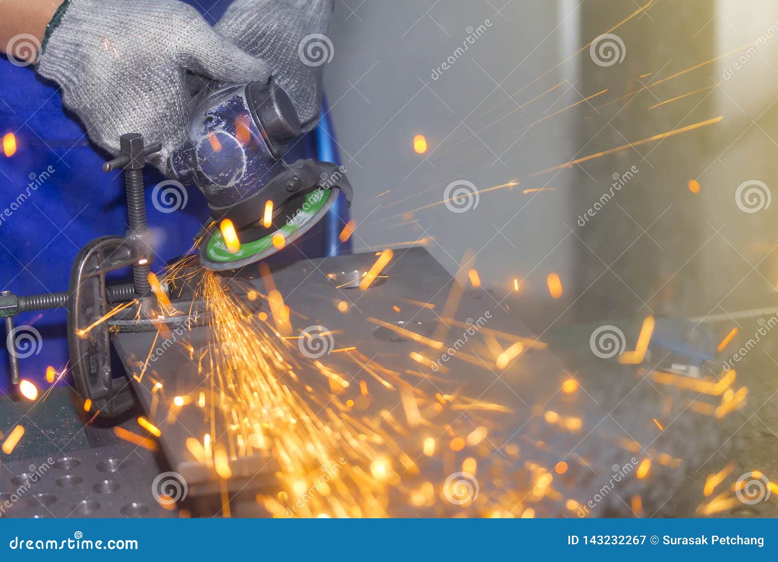 Close Up Hand Worker and Electric Wheel Grinding Machine and Spark ...