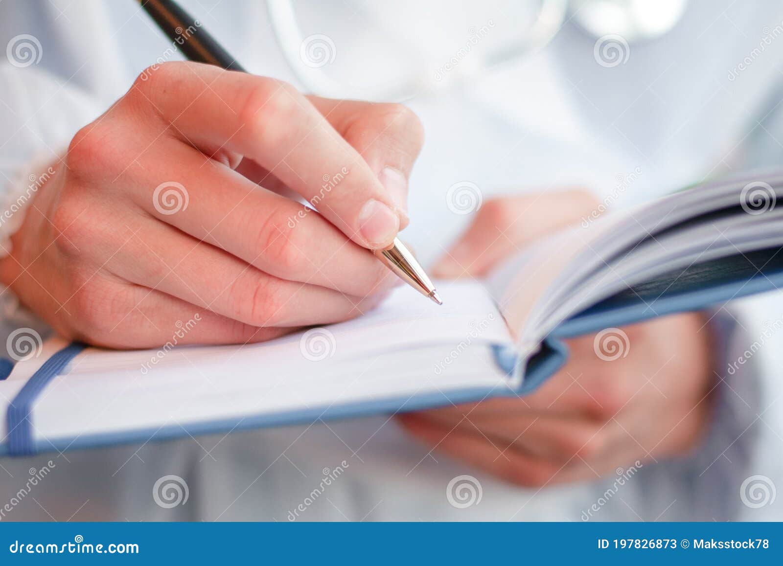 Close-up of a Hand Writing in a Notepad Stock Image - Image of holding ...