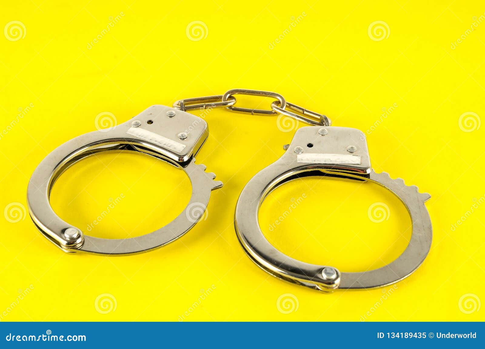Close-up of handcuffs stock image. Image of handcuff - 134189435