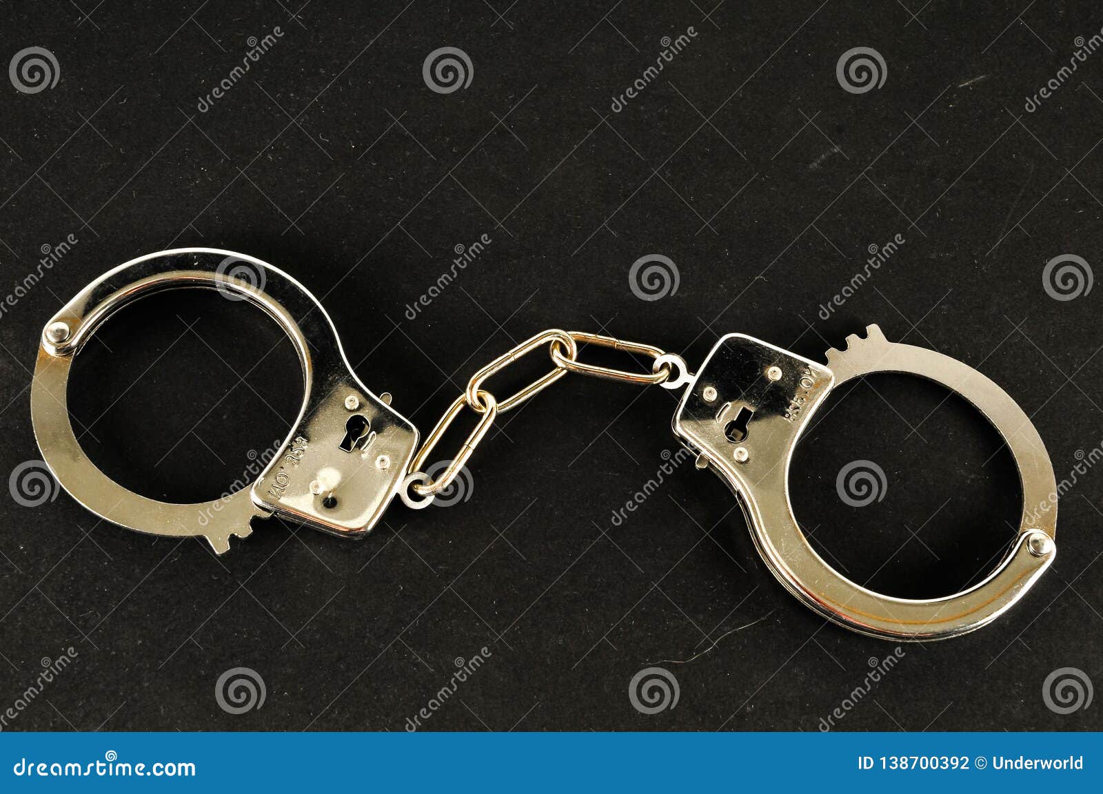 Close-up of handcuffs stock photo. Image of white, horizontal - 138700392
