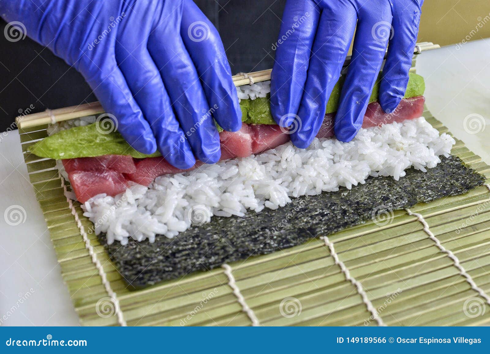 Close-up of the Hands of a Chef Making Sushi. Stock Photo - Image of ...
