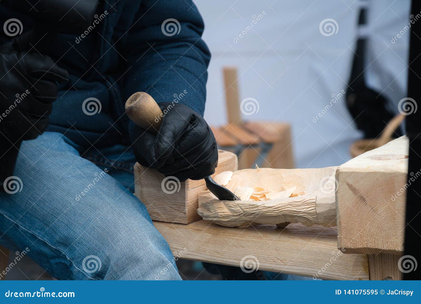 Close Up of Hands of Craftsman Carve with a Gouge in the Hands on the ...