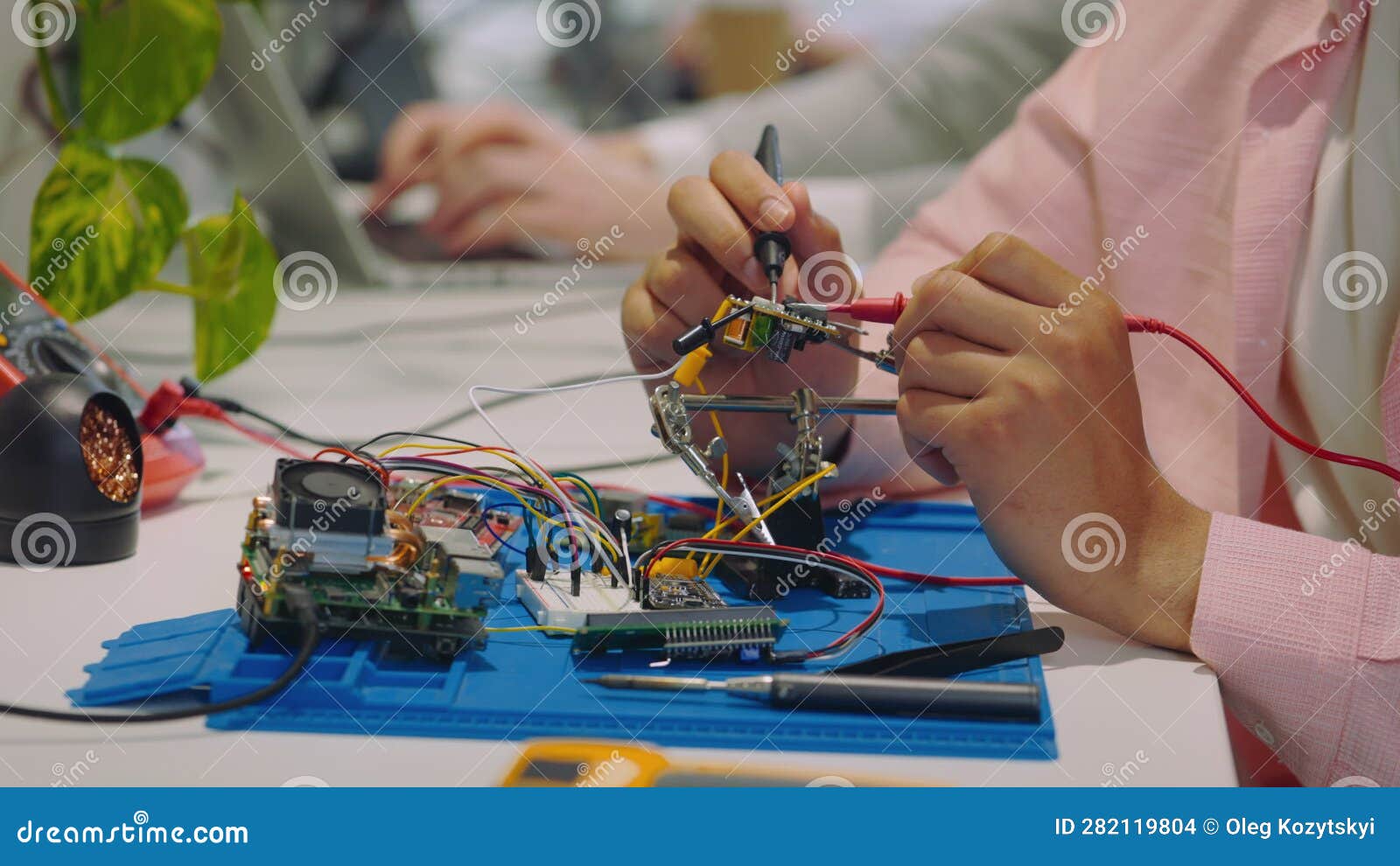 Close Up of the Hands of the Engineer Checking Circuit Voltage with ...