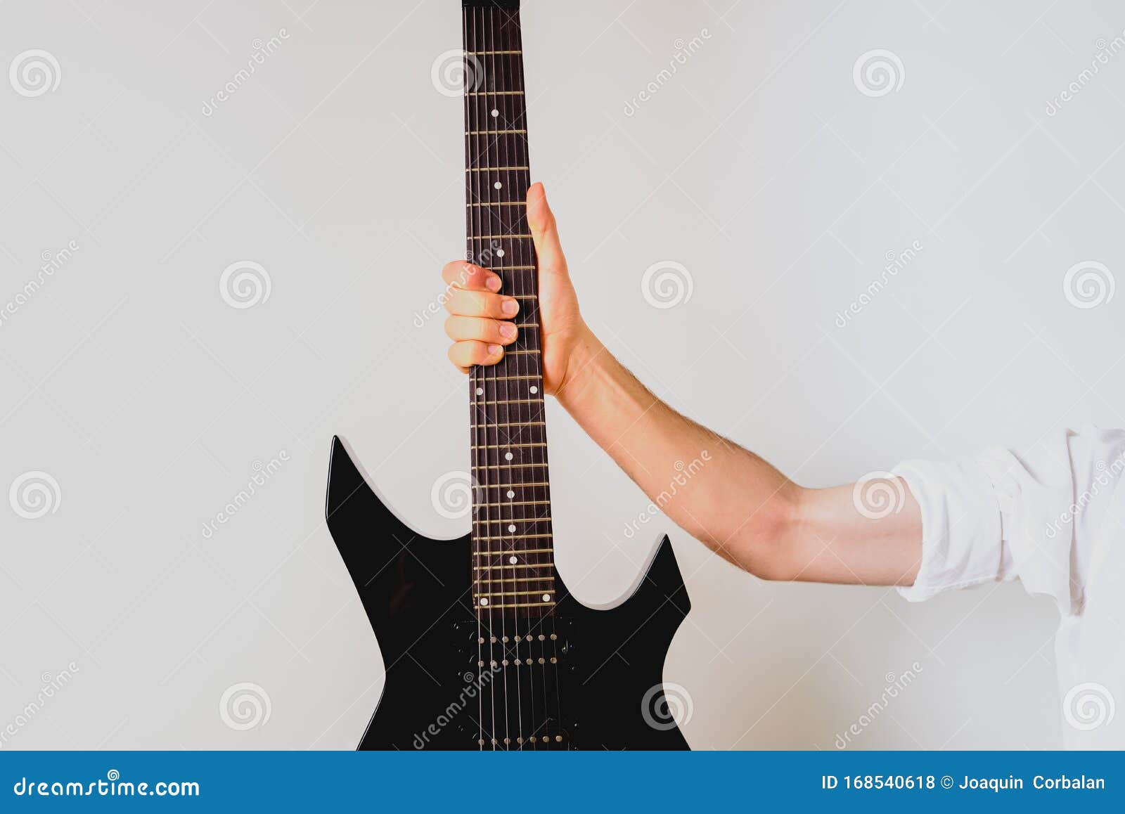 Close-up of the Hands of a Guitarist Performing a Song while Pressing ...