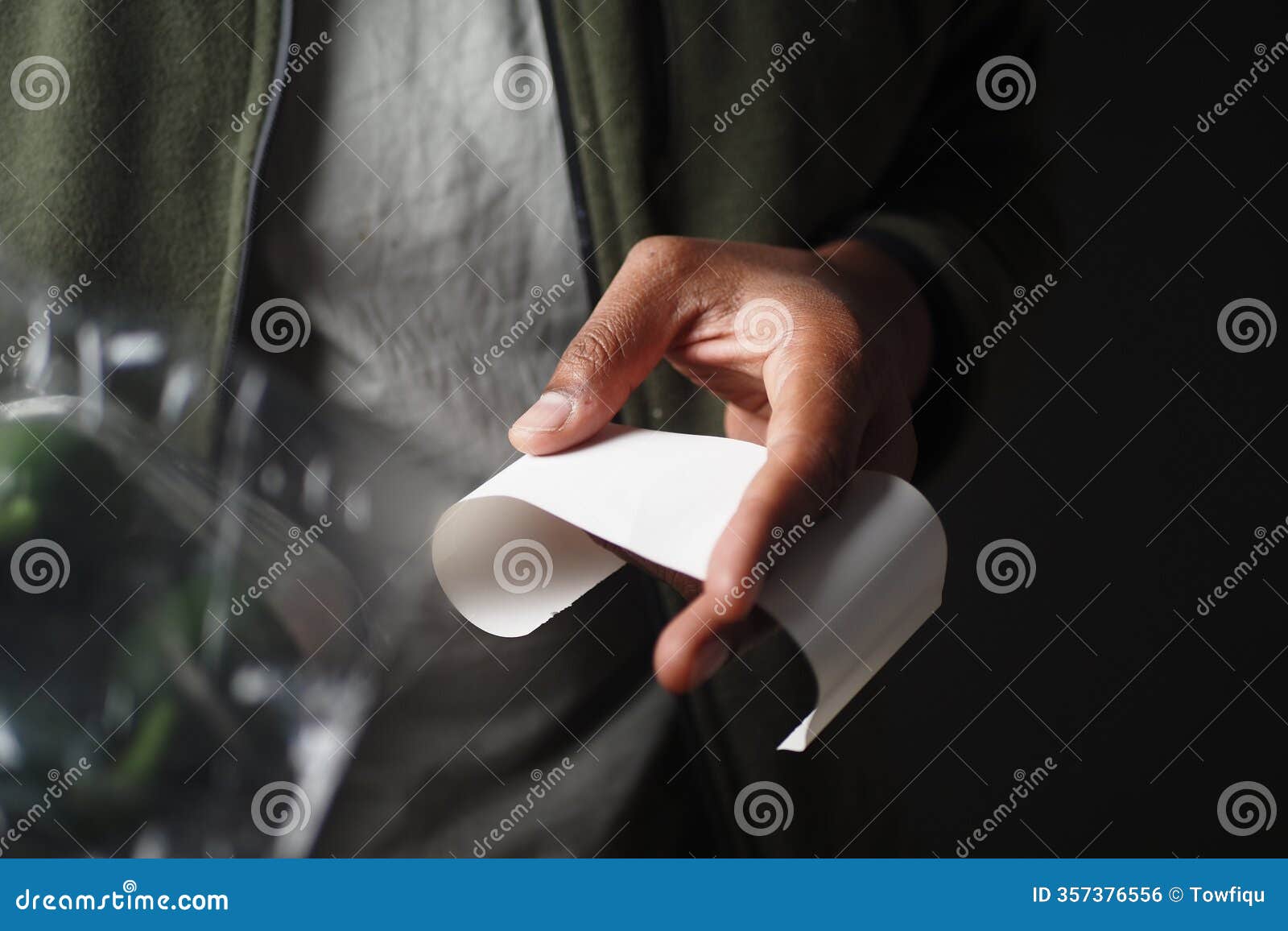 Close-Up of Hands Holding Receipt and Grocery Packet Stock Photo ...