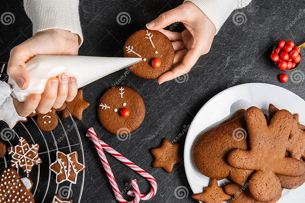 Close Up of Hands Icing Gingerbread Cookies Stock Photo - Image of home ...