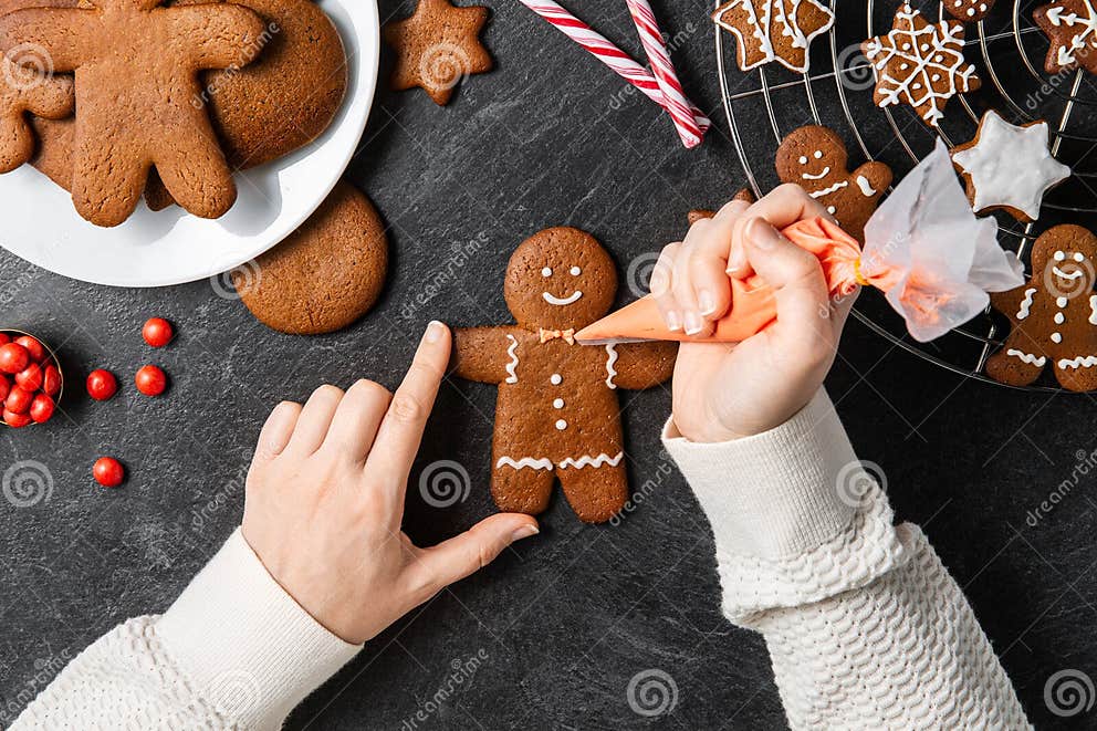 Close Up of Hands Icing Gingerbread Cookies Stock Photo - Image of ...