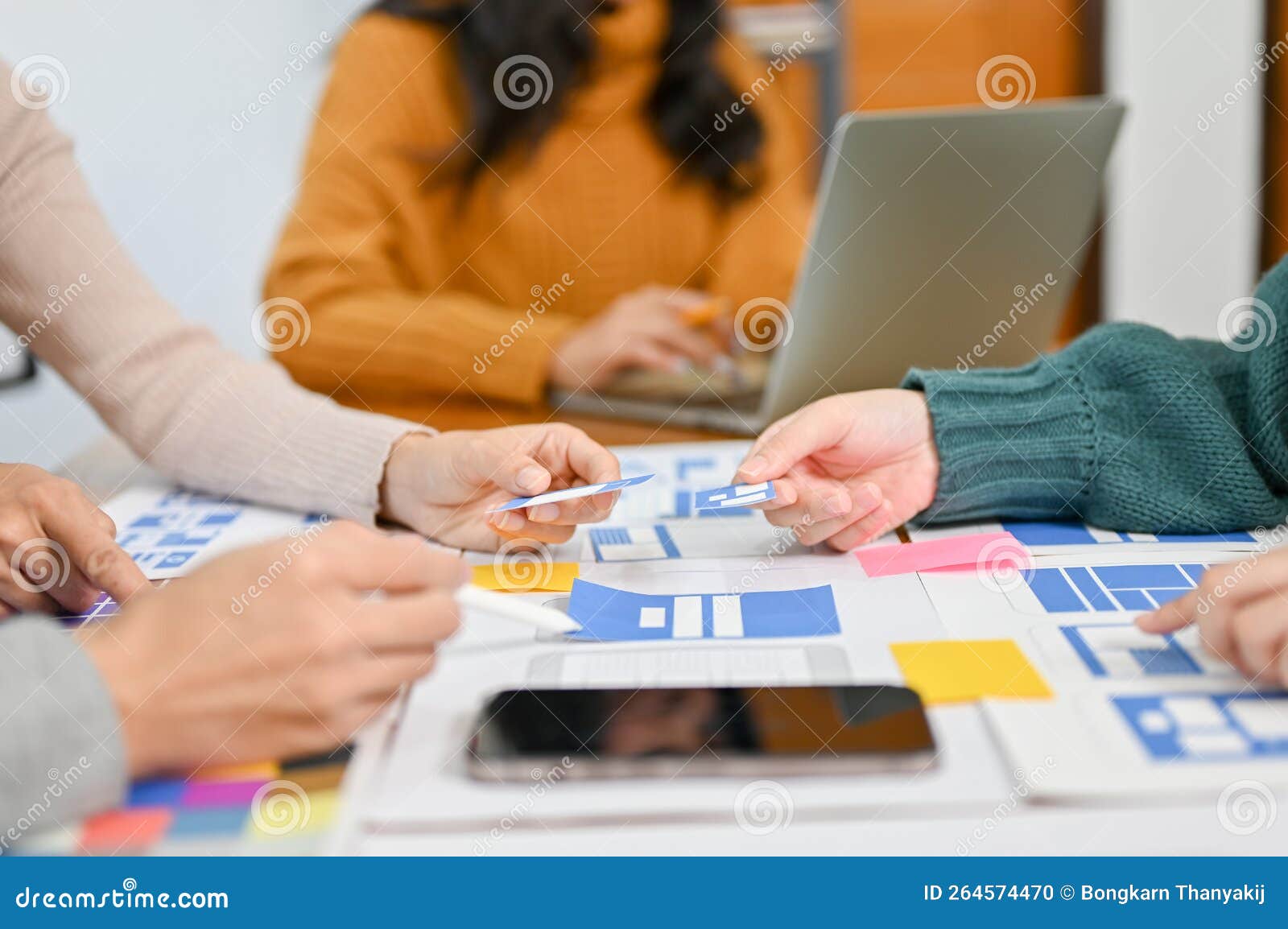 A Team of Mobile Application Developers are Discussing and Sharing ...