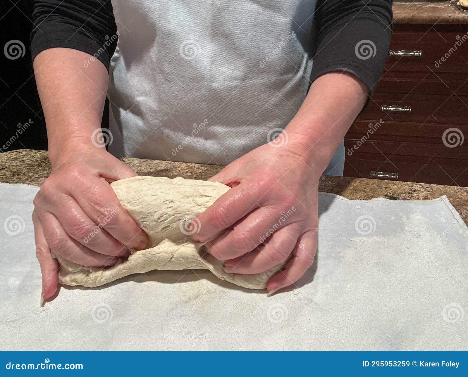 Kneeding bread dough stock image. Image of kitchen, floured - 295953259