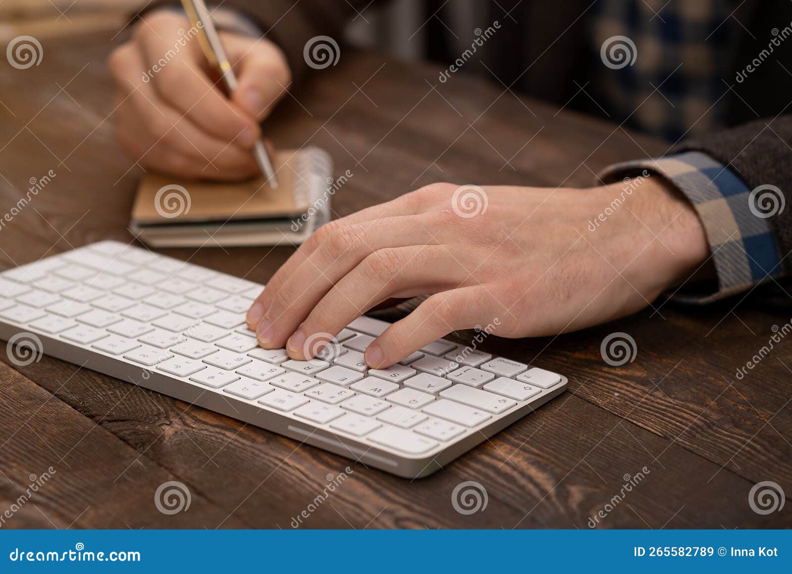 Close-up of Hands of Person Taking Noted on Paper White Typing on ...