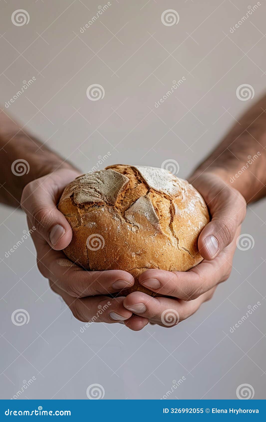 Close-up of Hands Presenting a Crusty Loaf of Bread, Symbolizing Baking ...