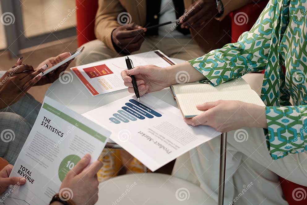 Team Members Collaborating on Data and Statistics in Office Stock Photo ...