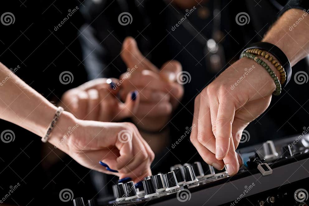Hands Adjusting Knobs, DJ Mixer, Collaborative Effort Stock Image ...